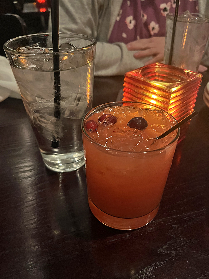 Drinks: A well-crafted cocktail glowing amber in the soft restaurant light &ndash; the perfect companion to good food and better conversation.