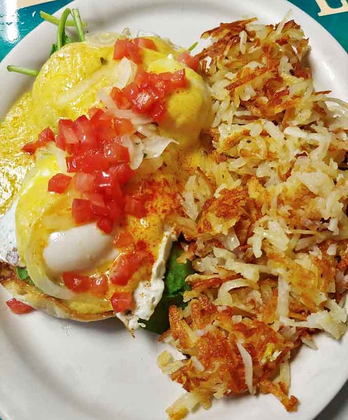 This eggs benedict florentine with perfectly crispy hash browns demonstrates why Uncle Loui's has mastered the art of breakfast.