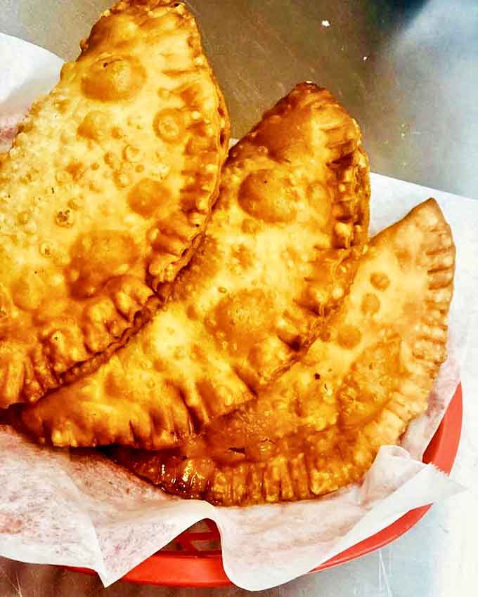 Golden empanadas with their crimped edges look like little treasure chests &ndash; crack one open and the aromatic filling is indeed gold.
