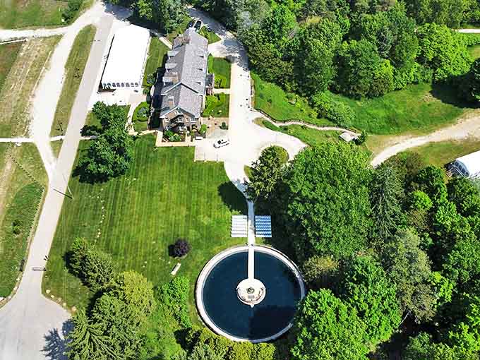 From above, the estate reveals its perfect symmetry&mdash;a human-made marvel nestled within nature's embrace. The circular fountain creates a bullseye of tranquility.