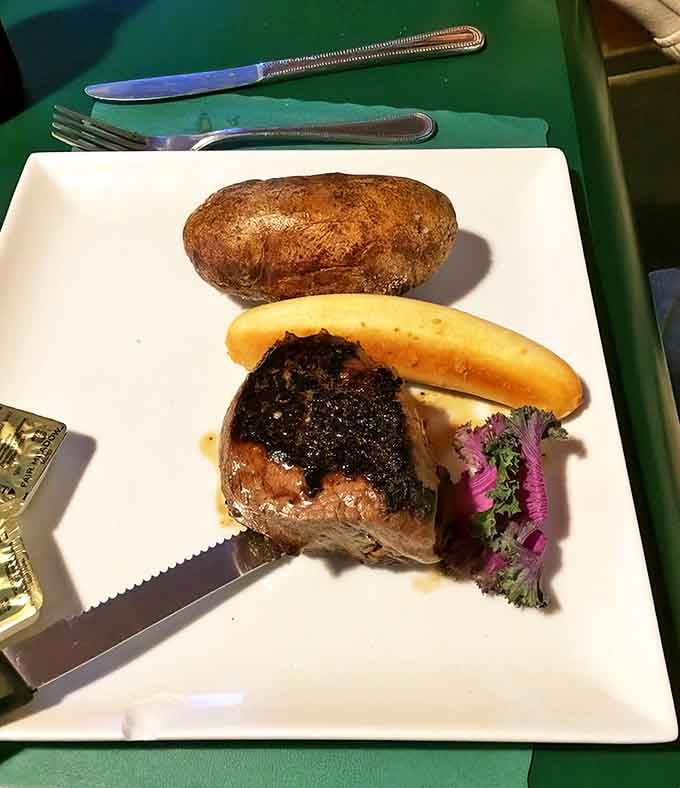 The filet mignon sits regally on its plate &ndash; tender enough to cut with a stern look, yet packed with flavor.