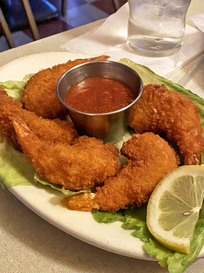 These golden crescents of seafood perfection deliver a satisfying crunch before revealing sweet, tender shrimp within.