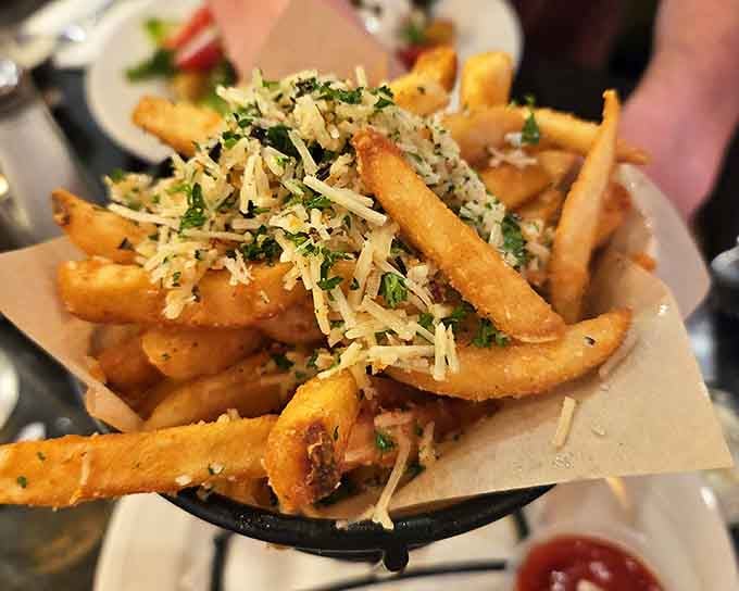 Truffle fries topped with parmesan and herbs, because sometimes regular fries just aren't fancy enough for your mood.