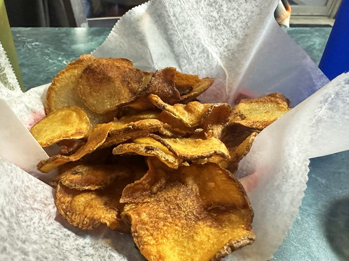 Homemade potato chips &ndash; impossibly thin, perfectly crisp, and utterly addictive. They'll ruin store-bought chips for you forever.