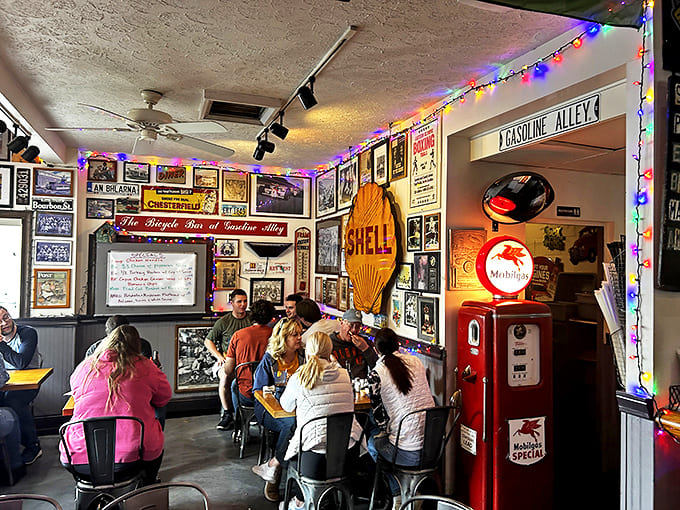 Diners of all ages gather beneath vintage signs and colorful string lights, united by their appreciation for good food and nostalgic vibes.