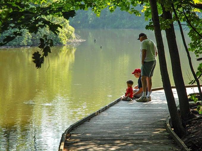 Generations connect at the lake's edge, where teaching a child to appreciate nature becomes a beautiful inheritance.