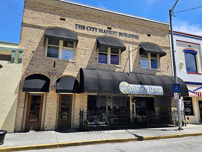 Green Door on 8th occupies the historic City Market Building, where brick walls have witnessed a century of commerce and conversation.
