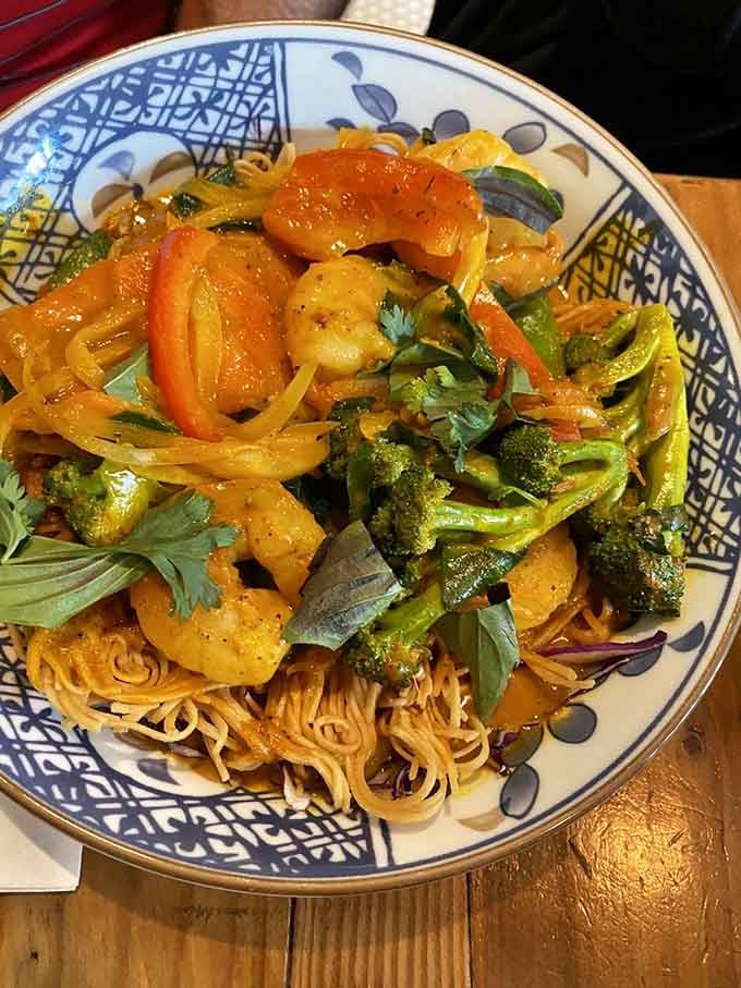 This shrimp curry over crispy noodles delivers the kind of flavor complexity that makes you slow down and pay attention to every bite.