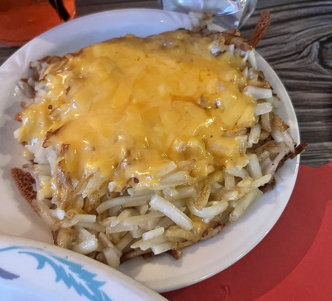 Golden hash browns topped with melted cheese &ndash; crispy on the outside, tender inside, and absolutely impossible to stop eating once you start.