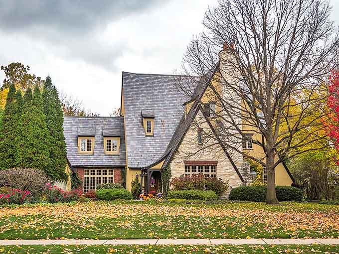 This Tudor Revival home showcases Riverside's diverse architectural styles, its autumn-kissed yard a canvas of seasonal colors.