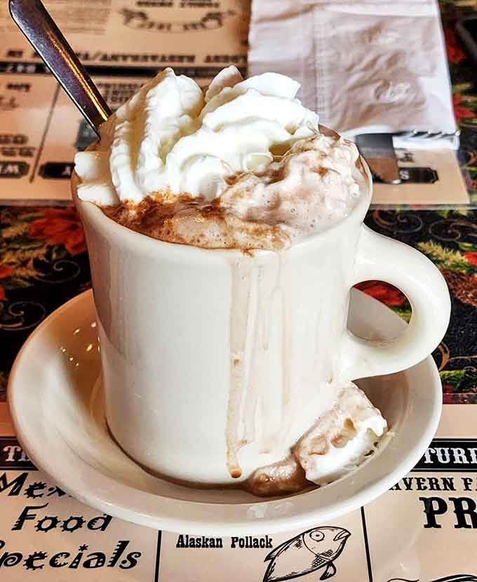 This isn't just hot chocolate&mdash;it's a warm hug in a mug, topped with a cloud of whipped cream that melts into creamy perfection.