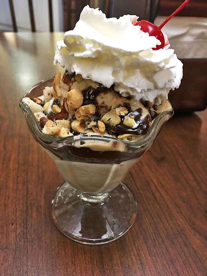 Hot fudge cascading over ice cream like a chocolate waterfall. Sherman's sundaes aren't just served; they're lovingly constructed.