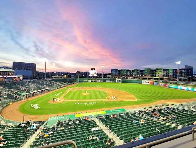 Jackson Field glows under evening lights as Lugnuts fans gather for America's pastime, where every foul ball becomes a treasured souvenir.