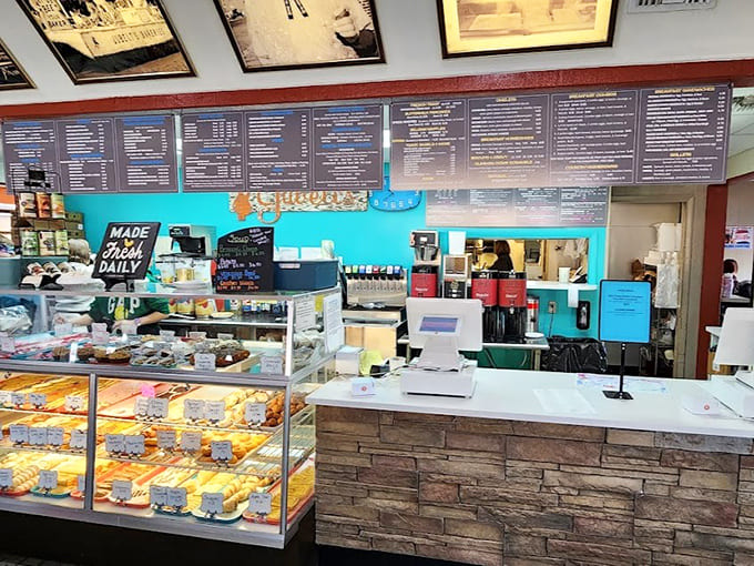 The counter area buzzes with activity as staff members work their magic, turning orders into edible happiness while maintaining that small-town friendliness.