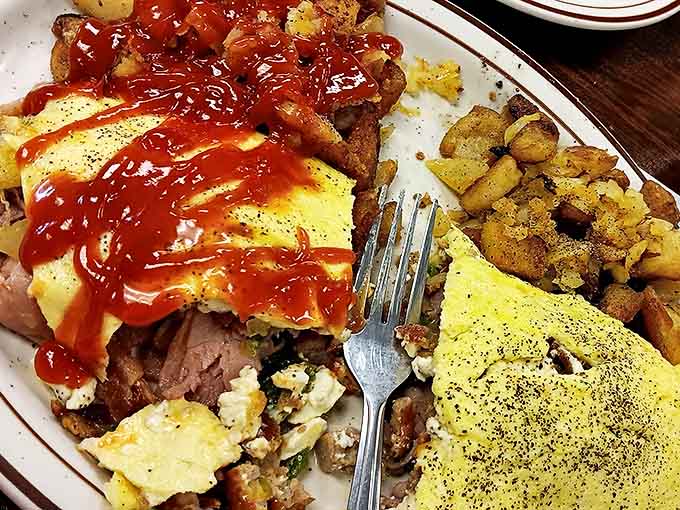Breakfast with attitude! This hearty plate topped with hot sauce proves that sometimes more is definitely more.