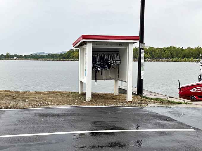 Safety first never looked so organized &ndash; these life preservers stand ready for water adventures while reminding us that preparation matters.