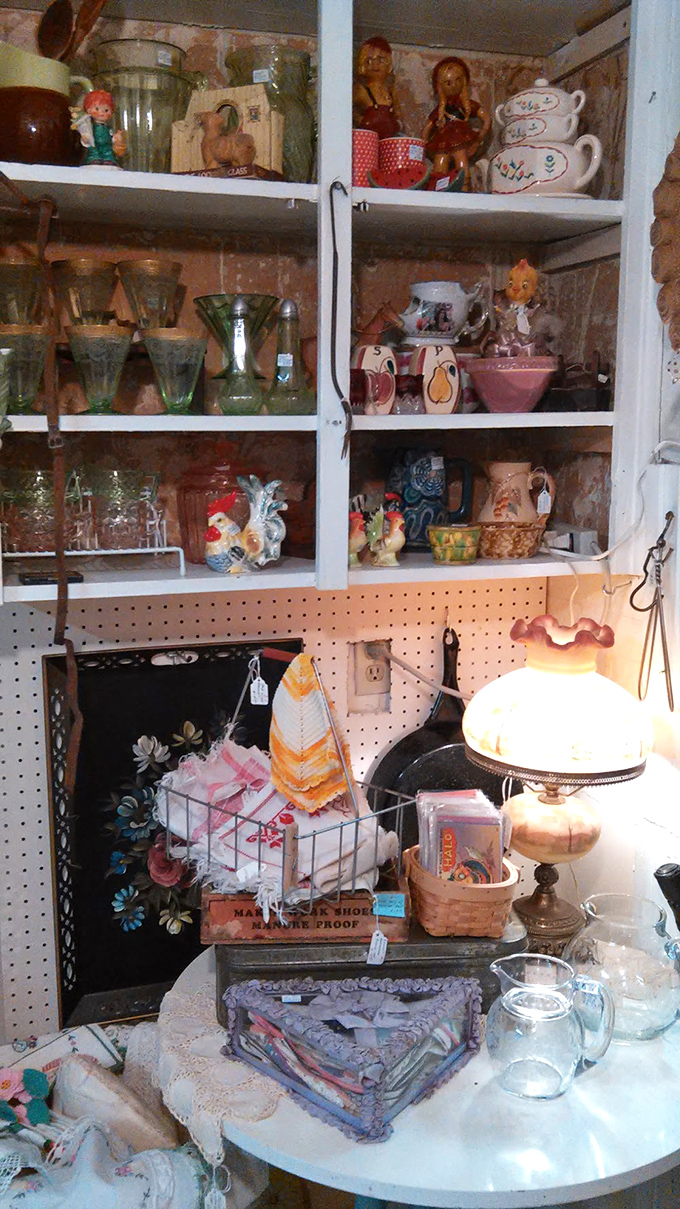 Vintage glassware in Depression-era colors and ceramic roosters create a cheerful vignette that captures the whimsical spirit of mid-century American kitchens at their finest.