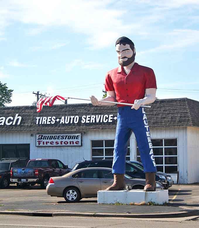 Standing proudly with his American flag, the Lauterbach Giant represents a uniquely American tradition of supersized roadside attractions.
