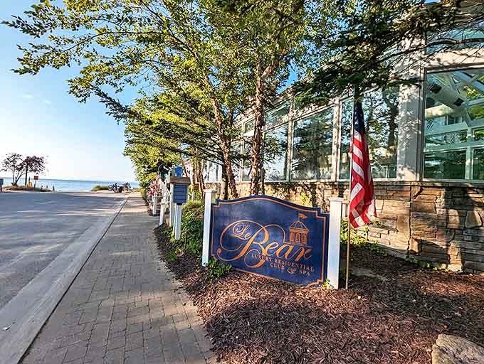 Le Bear Resort's elegant sign hints at the upscale comfort waiting inside, just steps from Lake Michigan's shores.