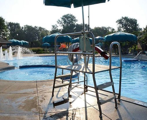 The watchful perch where safety meets summer fun, ensuring carefree splashing for swimmers of all ages.