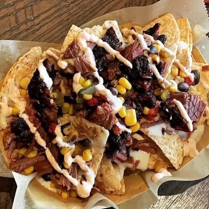 Nachos reimagined: Crispy chips playing host to a party of tender brisket, creamy cheese, and fresh toppings that'll ruin regular nachos forever.