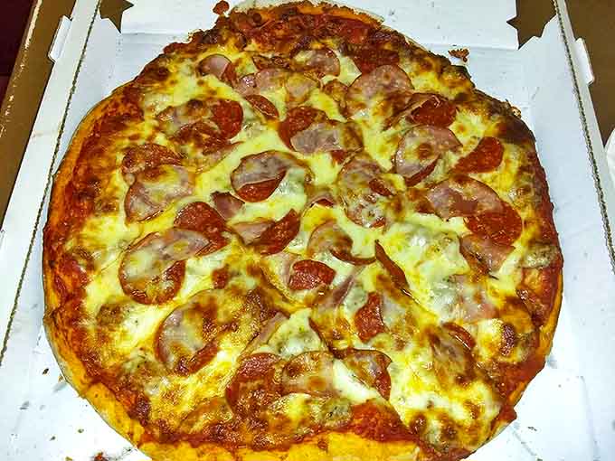 The meat lover's dream &ndash; a protein festival where pepperoni, sausage, and ham coexist in perfect harmony without collapsing the crust.