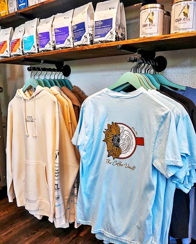 Coffee beans and branded gear line the shelves, letting you take the vault experience home with you.