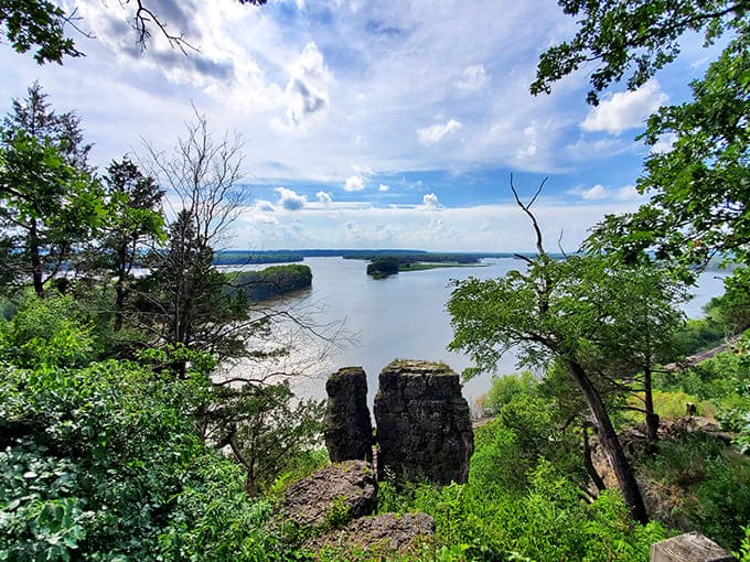 The mighty Mississippi stretches toward the horizon, its waters carrying the stories, commerce, and dreams of America between shores that have witnessed it all.