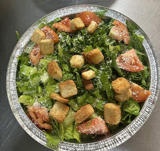 Fresh salad with croutons and cheese, for when you need to pretend you're being healthy before the pizza arrives.