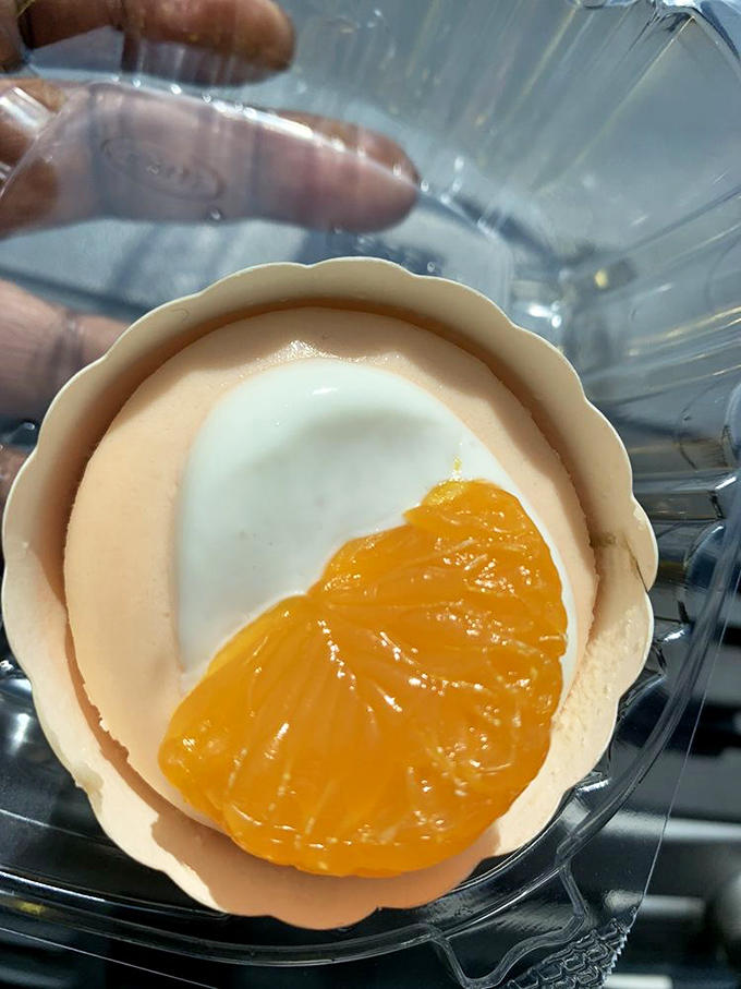 Sunshine in dessert form &ndash; this orangesicle cheesecake captures summer nostalgia with its bright citrus slice and creamy white base that screams "poolside treat."