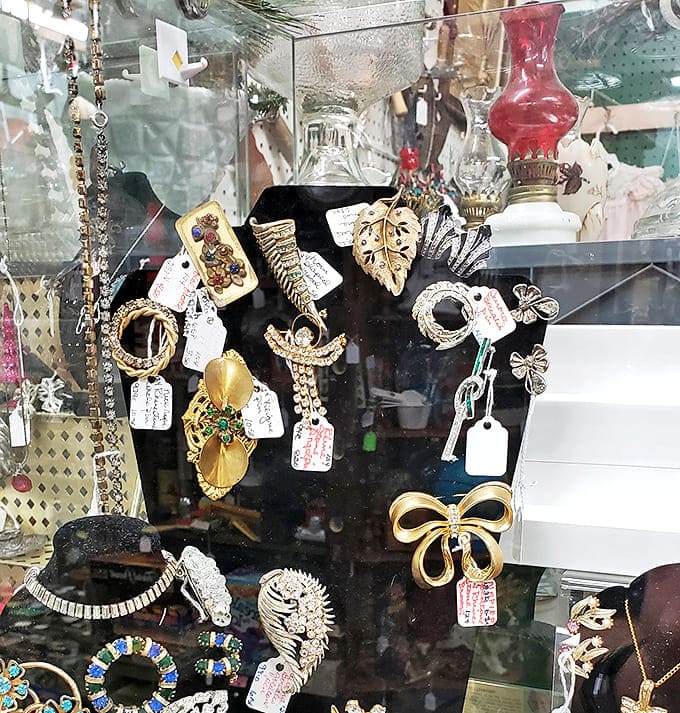 Rhinestones and costume pieces that once adorned society ladies now wait for their second act. That butterfly brooch is practically begging for a revival.