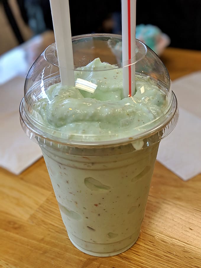 This pistachio milkshake isn't just a drink &ndash; it's a pale green promise of creamy satisfaction through not one but two straws.
