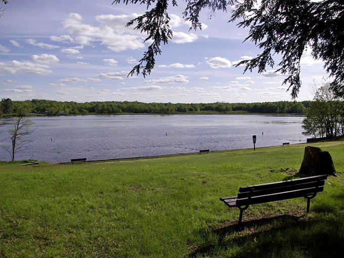 Contemplation comes naturally when sitting on this lakeside bench, where the view changes constantly yet somehow remains timeless.