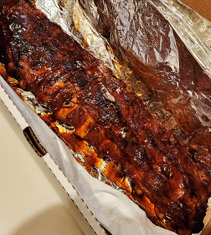 Fall-off-the-bone ribs slathered in tangy sauce &ndash; proof that J.B. Alberto's mastery extends well beyond their pizza fame.