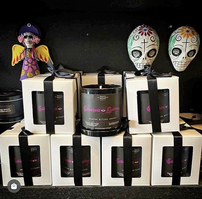 Elegantly packaged ritual candles topped with Day of the Dead figurines blend cultural traditions into home décor that's both meaningful and macabre.
