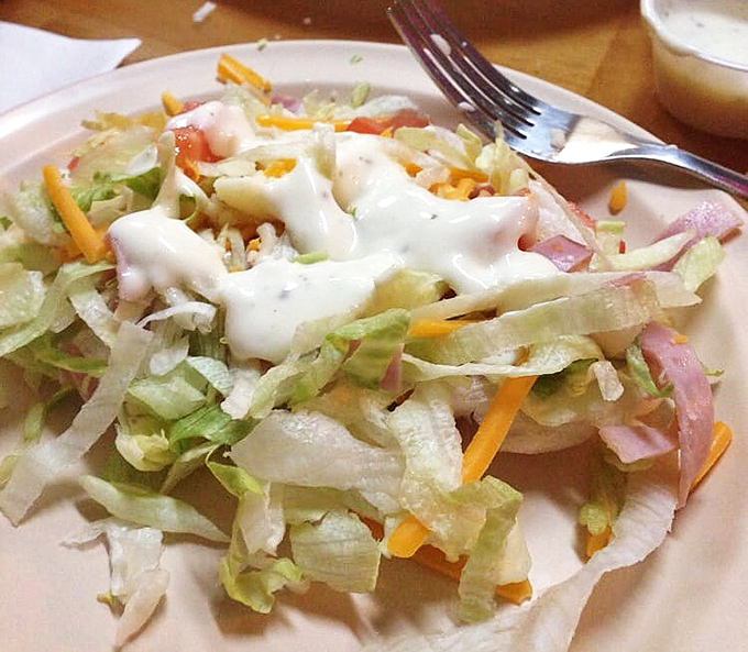 A salad that doesn't apologize for being a salad &ndash; fresh, crisp, and substantial enough to hold its own against its pizza menu neighbors.