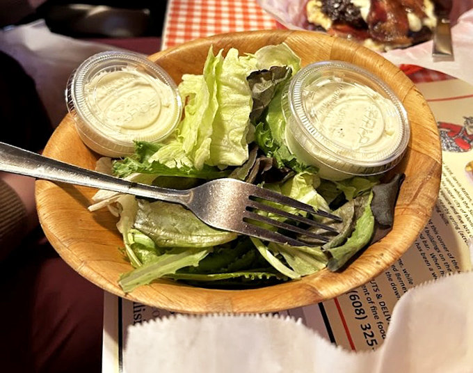 A fresh garden salad served in a wooden bowl &ndash; the perfect lighter option between heartier indulgences.