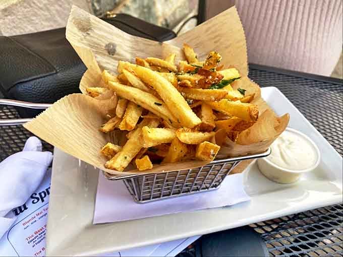 Golden, crispy potato perfection dusted with parmesan and herbs – these aren't fries, they're edible works of art.