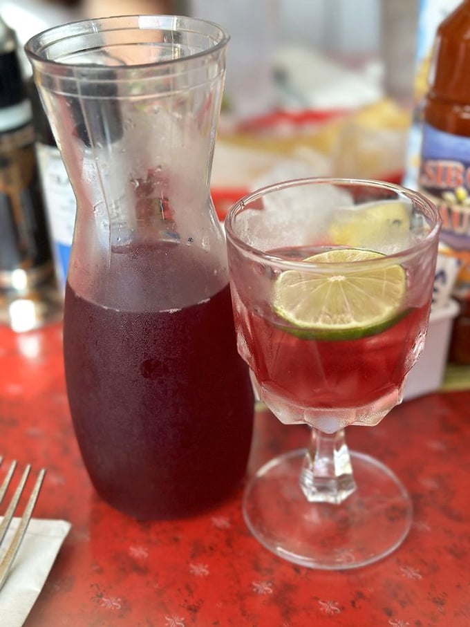 That sangria isn't just a pretty face &ndash; it's liquid vacation spirit, cutting through the sandwich's richness with fruity, boozy perfection.