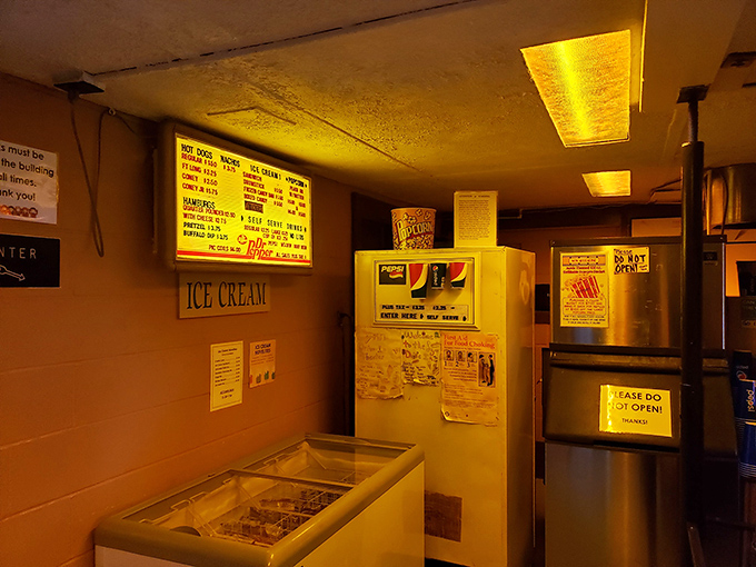 The snack bar's vintage menu board showcases timeless treats, proof that movie munchies transcend technological revolutions.