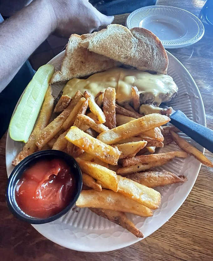 The steak sandwich transforms Pickwick's legendary beef into handheld perfection &ndash; tender slices nestled in a toasted roll with golden fries standing guard.