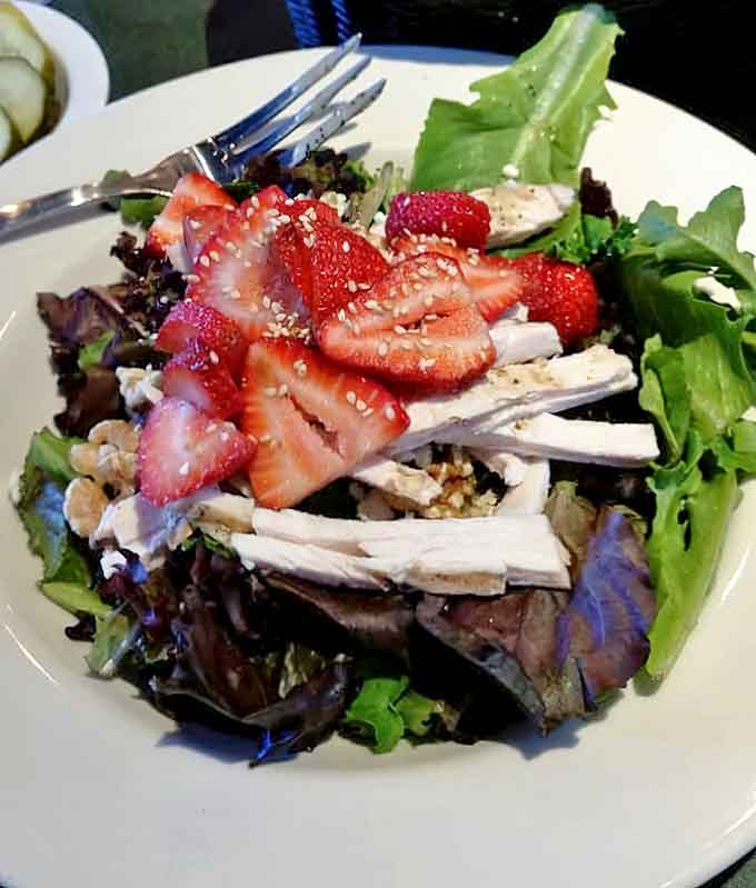 Summer on a plate! Fresh strawberries dance with grilled chicken and mixed greens in this refreshing seasonal salad.