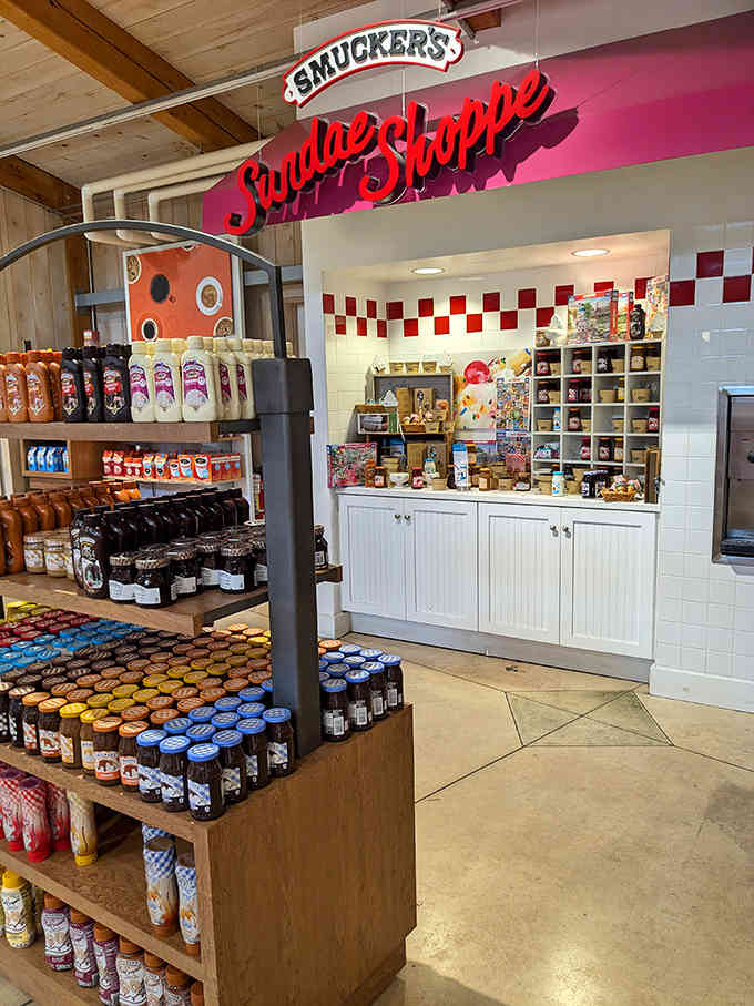 The Sundae Shoppe beckons with its retro-styled sign, promising ice cream delights enhanced by Smucker's legendary toppings.