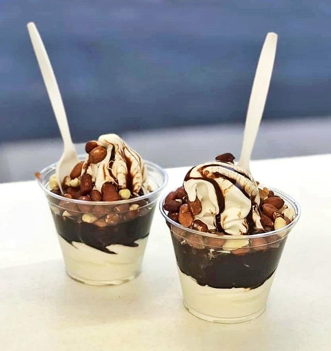 Sundaes at Earl's don't just satisfy sweet tooths – they create lifelong memories. Vanilla soft serve, hot fudge, and peanuts combine for textural symphony.