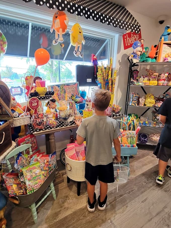 The candy section transports young visitors to a wonderland of colorful temptations, where decisions become delightfully difficult.
