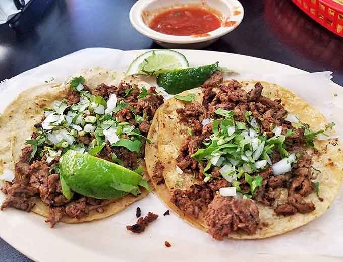 Al pastor tacos with that perfect balance of meat, onions, cilantro, and just enough grease to be interesting.
