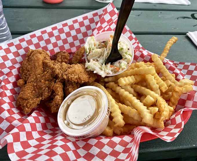 Chicken tenders that are actually tender, served with waffle fries and coleslaw, comfort food that doesn't disappoint your inner child.