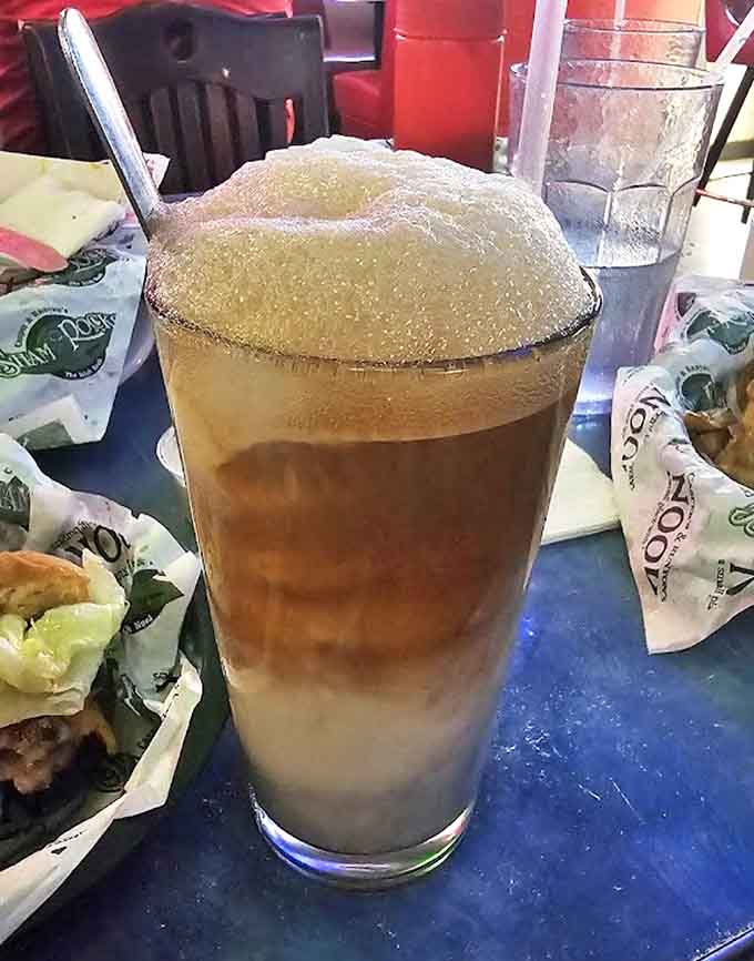Nostalgia in a glass, with creamy vanilla ice cream slowly melting into spicy root beer, creating a frothy mustache-maker.