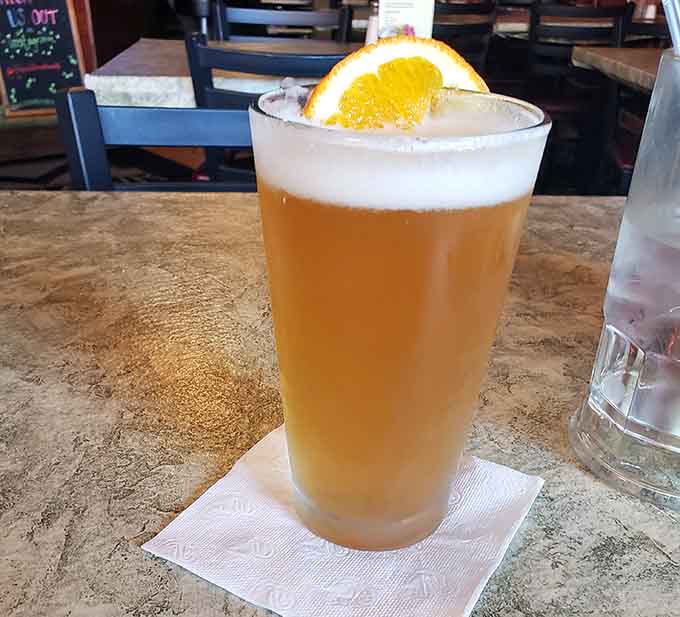 A cold, frothy beer with a citrus garnish is the perfect companion to your meal at this neighborhood favorite.