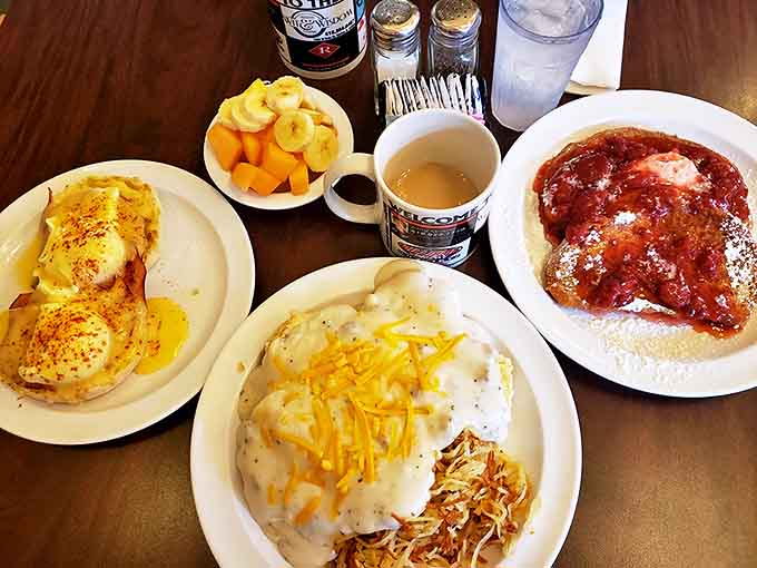 A hearty breakfast spread featuring eggs, biscuits, gravy, and fresh fruit proves balanced meals can still satisfy your comfort food cravings completely.